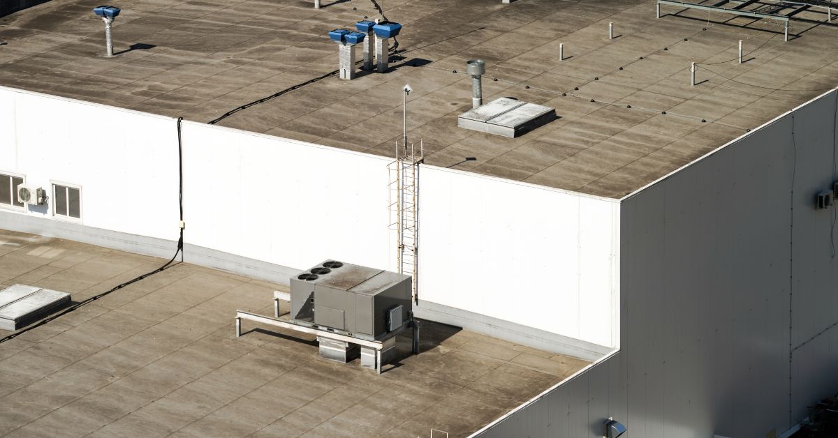 Why Do Commercial and Condo Building Roofs Tend to Be Flat? - Vantage ...